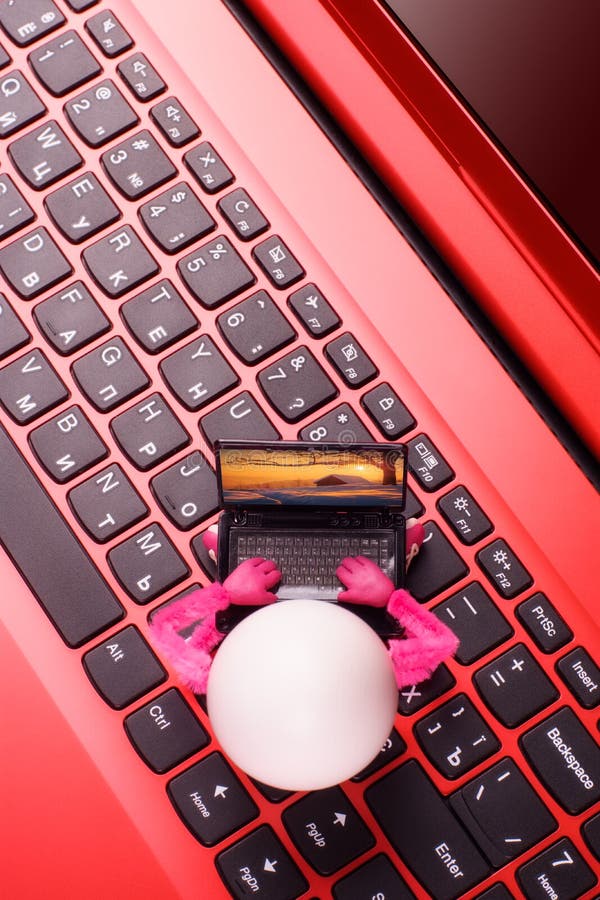 Easter Egg with Notebook Computer Sitting on a Book in a Library Stock ...