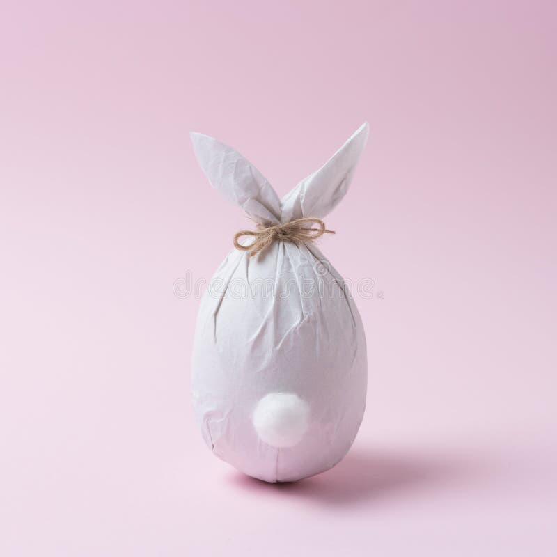 Easter Egg Wrapped in a Paper in the Shape of a Bunny. Minimal Easter ...
