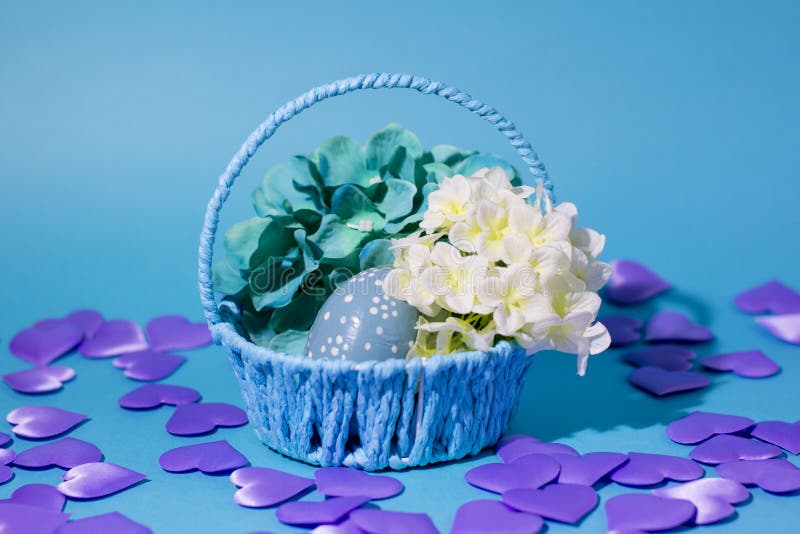 Easter Eggs on a Blue Background in a Blue Basket. Stock Photo - Image ...