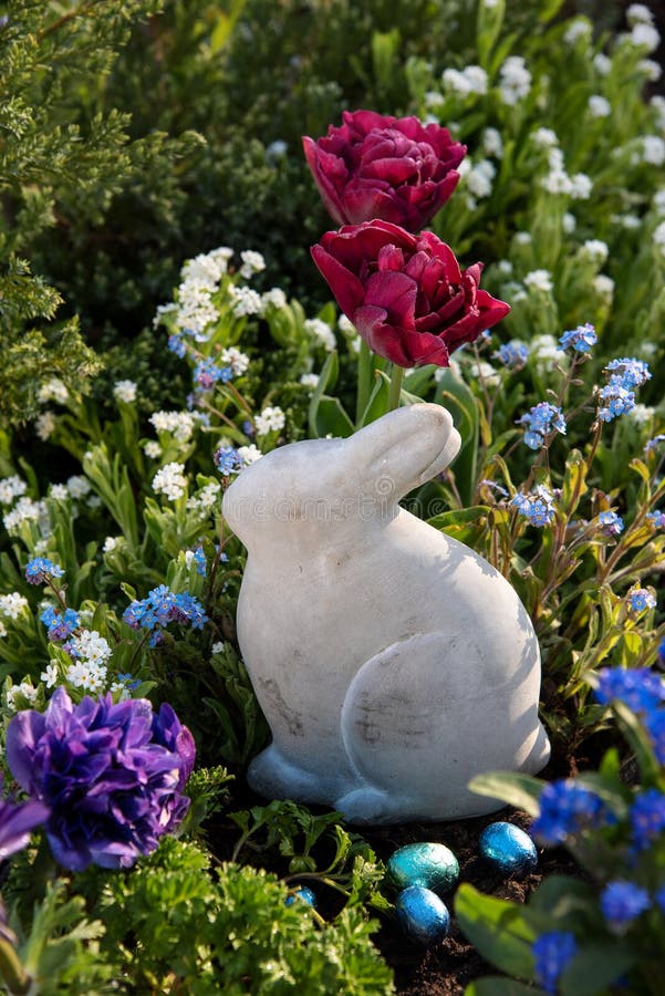 Easter Eggs and Bunny in the Garden Near Flowers Stock Image - Image of ...