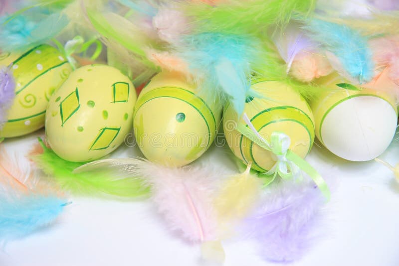 Easter eggs with feathers stock image. Image of chicken - 22893621
