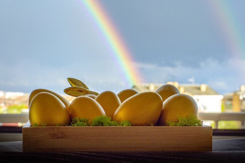 Easter Eggs in Front of a Window with a View of a Rainbow Stock Image ...