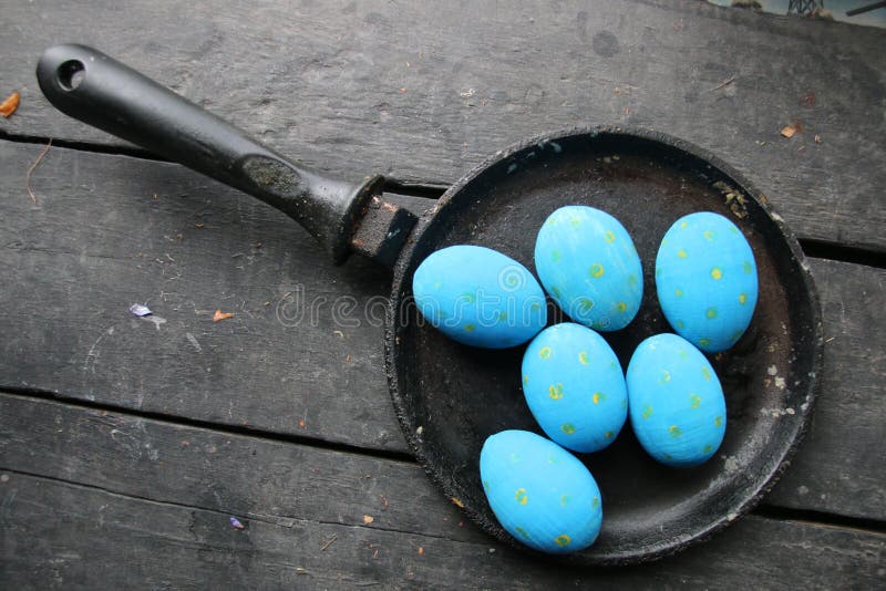 Easter Eggs in a Frying Pan on Vintage Table Stock Photo - Image of ...