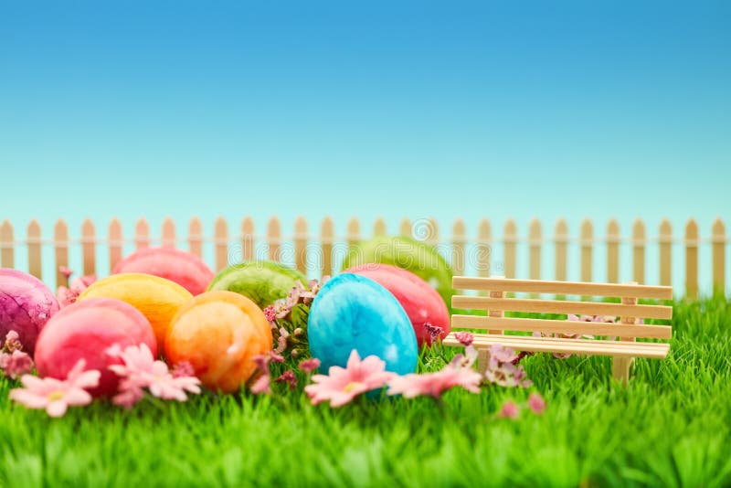 Easter Eggs in the Garden for Easter beside Bench Stock Image - Image ...