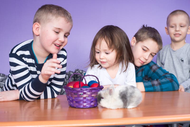 Easter Eggs, Kids and Bunny Stock Photo - Image of girl, playful: 87757160