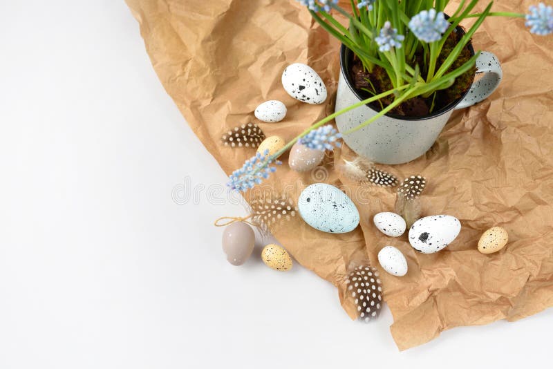 Easter Eggs and Light Blue Muscari Flowers in Cup on a White Table ...