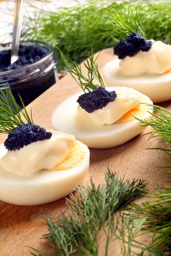 Easter Eggs with Mayonnaise and Black Caviar Stock Image - Image of ...