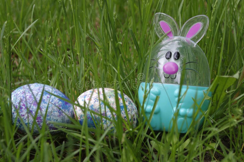 Easter Eggs with Plastic Bunny in Grass with Copy Space Stock Photo ...