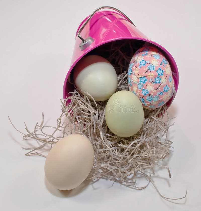 Several Easter Eggs Spilling from a Pink Bucket Stock Image - Image of ...