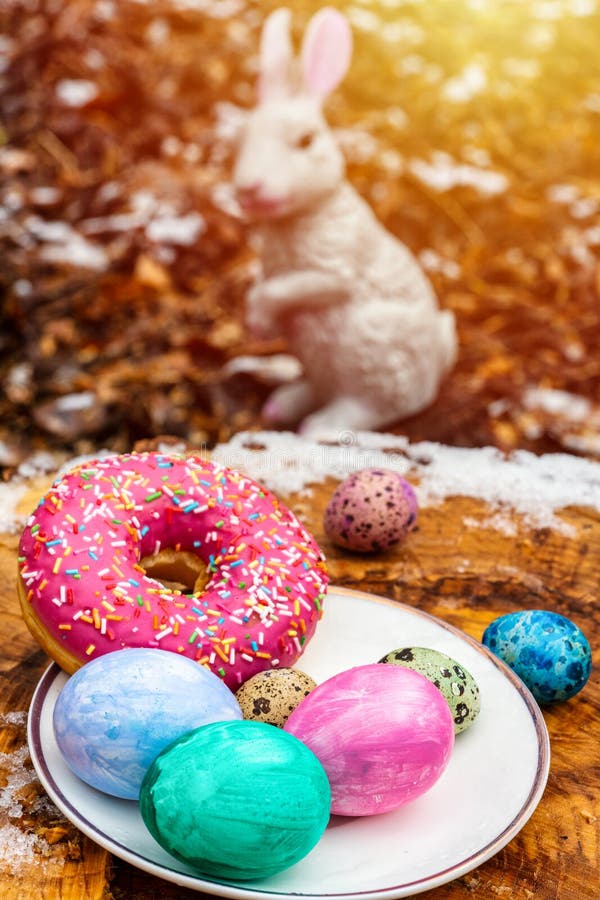 Easter Eggs and Toy Bunny in the Snow in the Forest Stock Image - Image ...