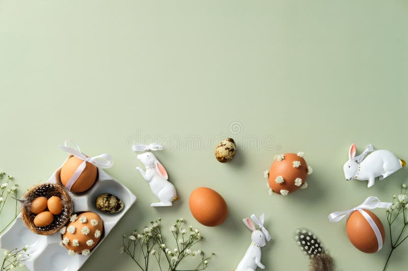 Easter Flat Lay Composition with Decorated Eggs, Ceramic Bunnies, and ...