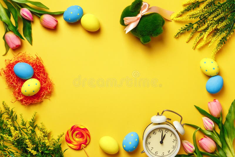 Easter Frame. Eggs Bunny Flowers Alarm Clock on a Yellow Background ...