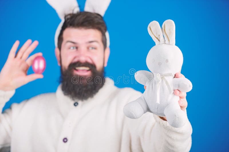 Easter Fun. Bearded Man with Bunny Toy and Easter Egg. Hipster with ...