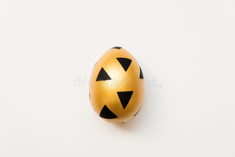 Easter Golden Egg with Triangular Black Pattern Isolated on White ...
