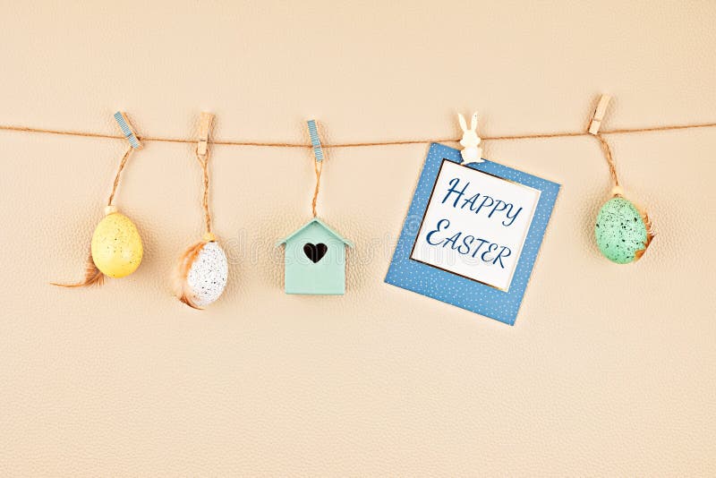 Easter Greeting Card Hanging on the String with Cute Easter Accessories ...