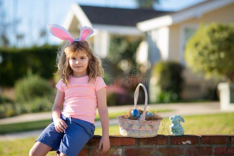 Easter Kid in Park. Child in Bunny Ears Hold Easter Egg. Boy Hunting ...