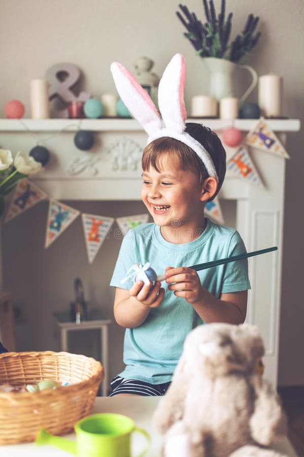 Easter. a Little Boy is Painting Easter Eggs Stock Photo - Image of ...