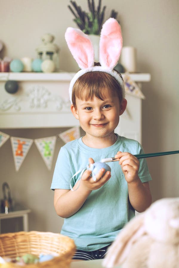 Easter. a Little Boy is Painting Easter Eggs Stock Photo - Image of ...