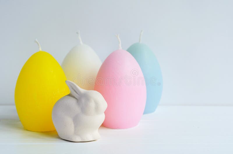 Easter Ostara, Eoster Bunny with Egg Shaped Candles Stock Photo - Image ...