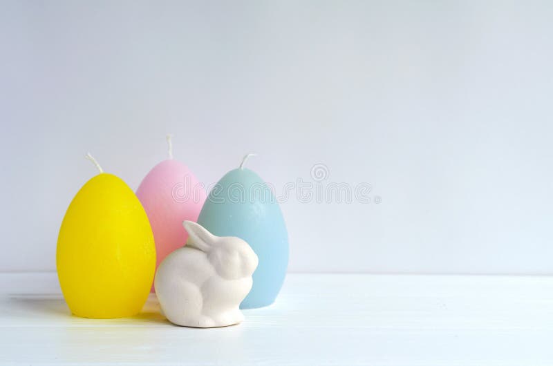Easter Ostara, Eoster Bunny with Egg Shaped Candles Stock Photo - Image ...
