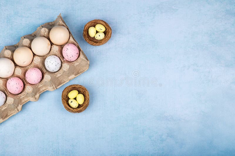 Easter Pink and White Eggs in an Egg Stand on a Blue Background ...