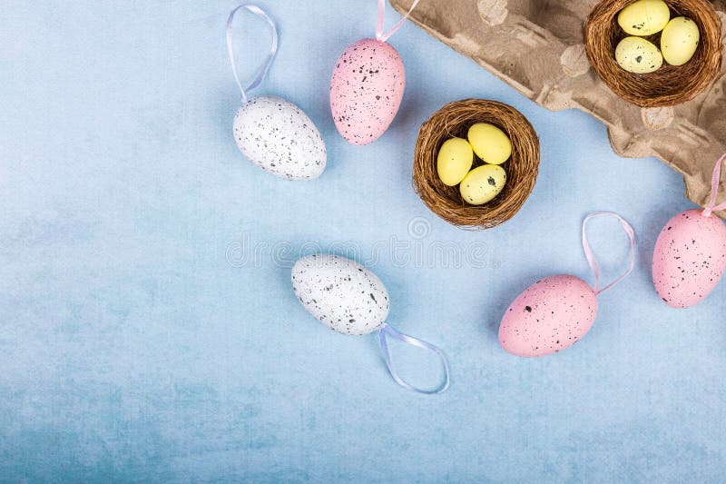 Easter Pink and White Eggs in an Egg Stand on a Blue Background ...