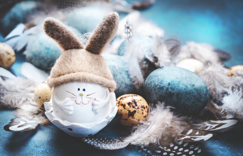 Easter Rabbit with Blue Painted Eggs, Spotted Feathers on Blue ...