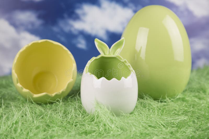 Easter Rabbit in a Shell of Eggs. Colorful Eggs. Green Grass, Flowers ...