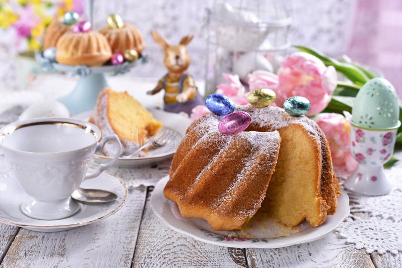 Easter Ring Cake with Powdered Sugar on Festive Table Stock Photo ...