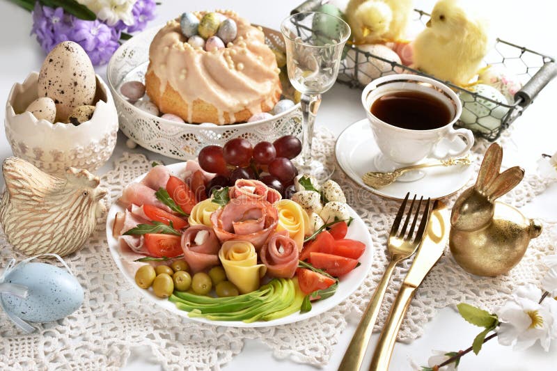 Easter Table with a Platter of Ham and Cheese Appetizer and Ring Cake ...