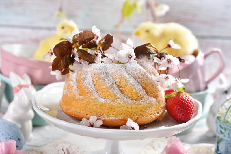 Easter Table with a Ring Cake and Spring Decorations Stock Photo ...