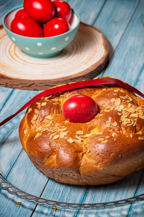 Easter Traditional Bread, Greek Tsoureki and Red Eggs on a Table Stock ...