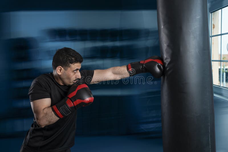Eastern Arab Boxer Looks at the Box with a Punching Bag Stock Photo ...