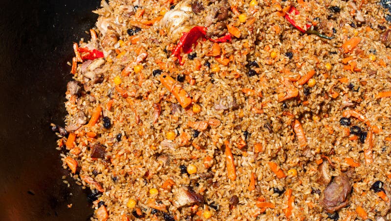 Eastern Pilaf in a Huge Cast-iron Pan. Close-up Stock Image - Image of ...