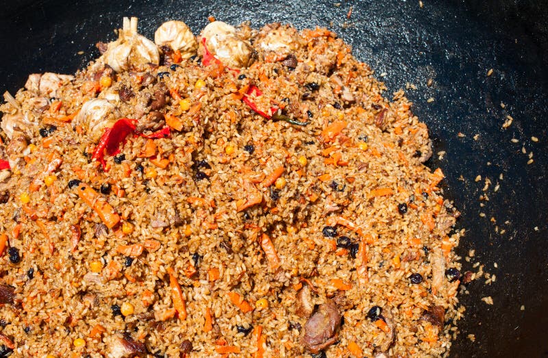 Eastern Pilaf in a Huge Cast-iron Pan. Close-up Stock Photo - Image of ...