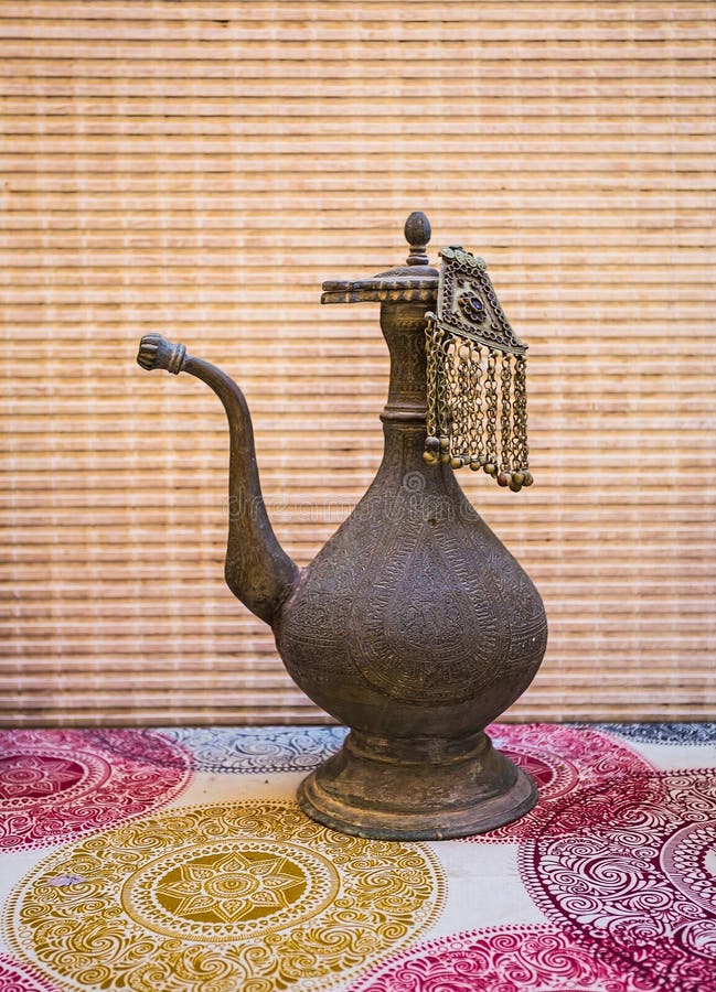 Eastern Pitchers Stand on a Shelf Stock Photo - Image of silver, rustic ...