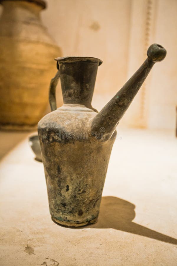 Eastern Pitchers Stand on a Shelf Stock Image - Image of ghawa, gold ...