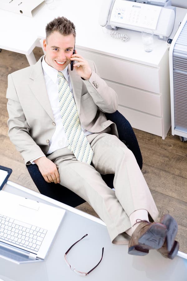 Businessman S Feet Propped Up on the Desk Stock Photo - Image of ...