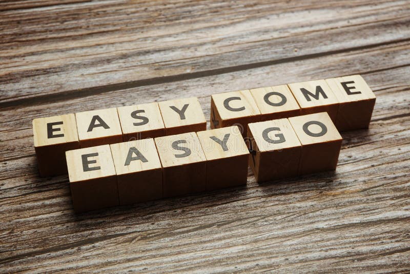 Easy Come Easy Go Alphabet Letters on Wooden Background Stock Image ...