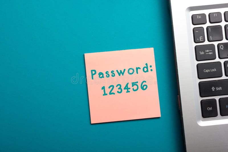 Easy Password Concept. Office Table Top View - Laptop and Reminder ...