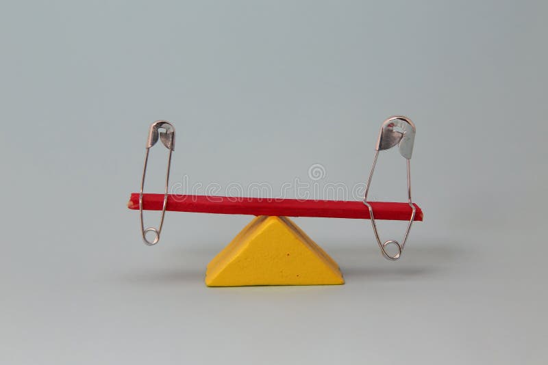 Easy Setup about Balance from Safety Pins. Stock Image - Image of ...