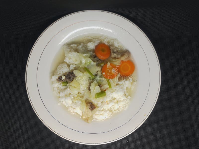 Easy Vegetable Soup with Rice in a White Dish Stock Photo - Image of ...