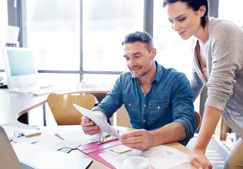 The Easy Way To Share Your Ideas. Two Coworkers Using a Tablet in a ...
