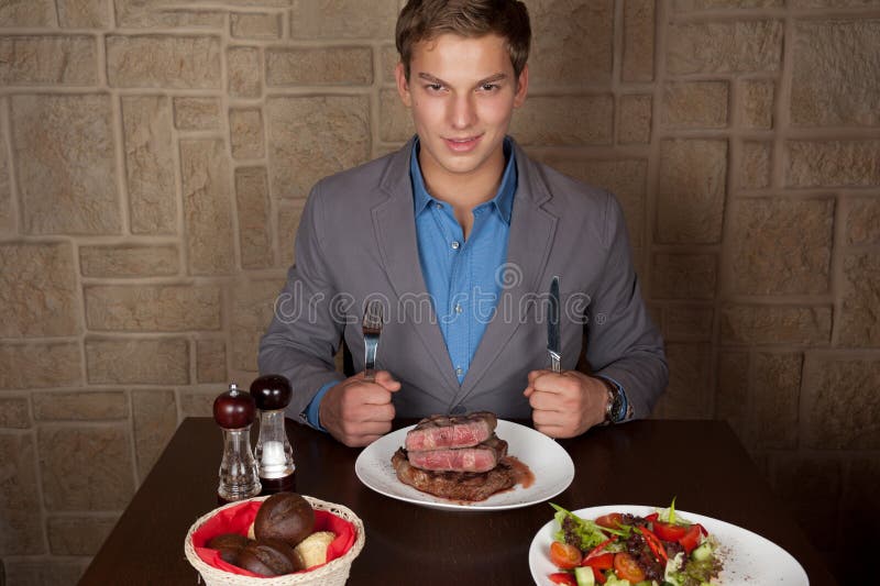 Eat a beef steak stock image. Image of food, male, beef - 32293313