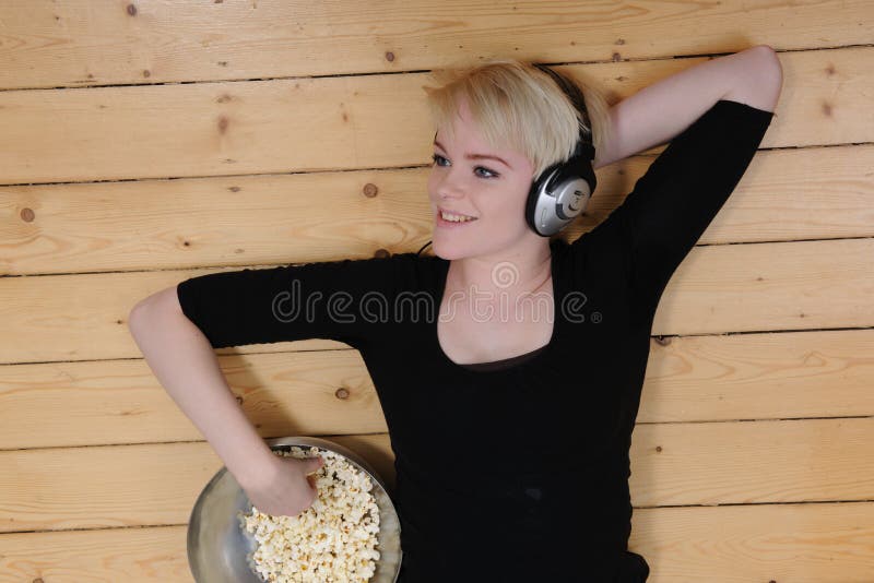 Eat Popcorn and Listen To Music Stock Image - Image of audio, bowl: 9299607
