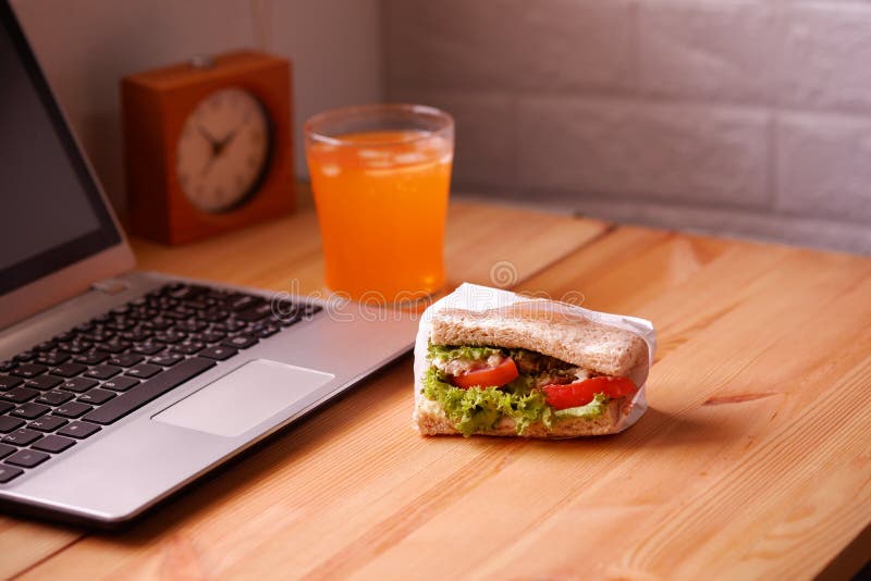 Eat Sandwich and Orange Juice. during Work with Laptop Computer. Work ...