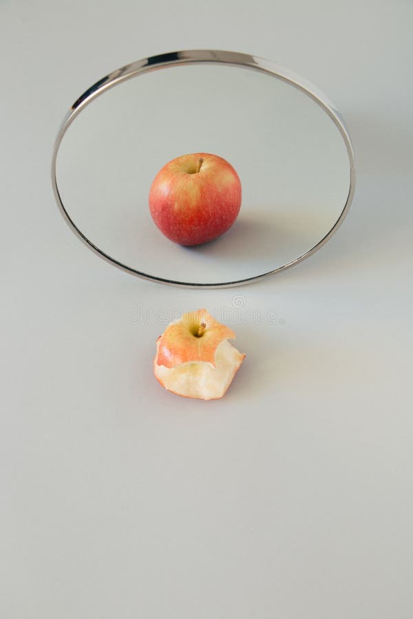 Eaten Apple Reflected As Being Fresh and Untouched in the Mirror ...