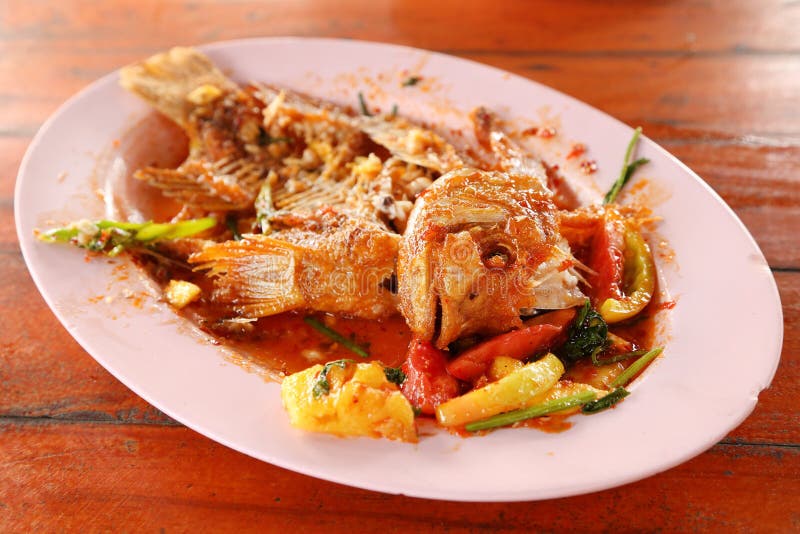Eaten Fried Ruby Fish Topped with Sweet,sauer and Hot Sauce Stock Image ...