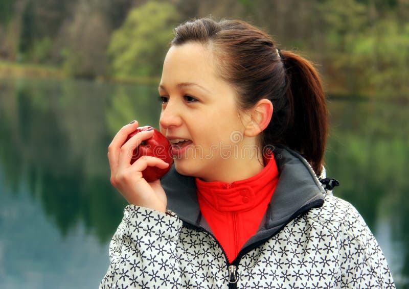 Eating an apple stock image. Image of soft, brunette - 24152517