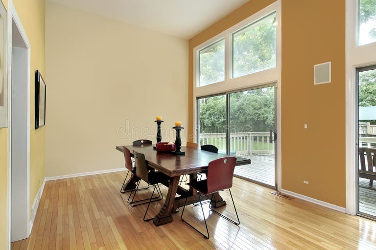 Eating Area with Two Story Windows Stock Photo - Image of kitchen ...